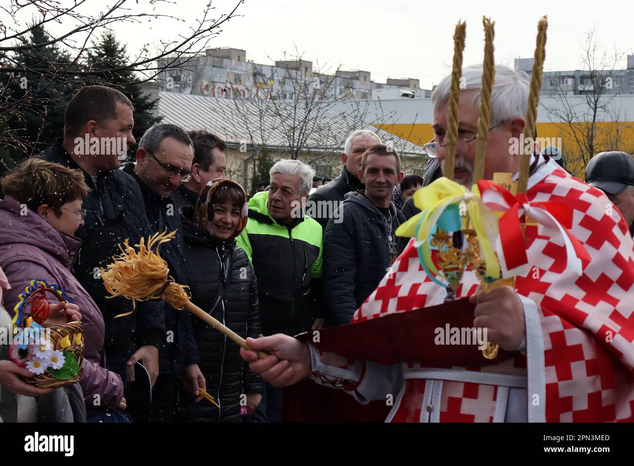 Orthodox Christian priest and worshipers are seen during the blessing ...