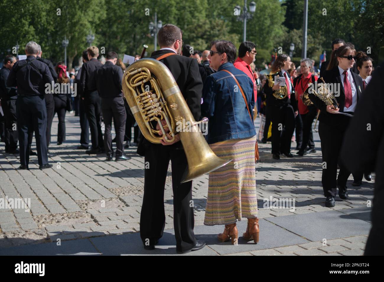 Madrid, Spain. 16th Apr, 2023. A musician carries a tuba during a ...