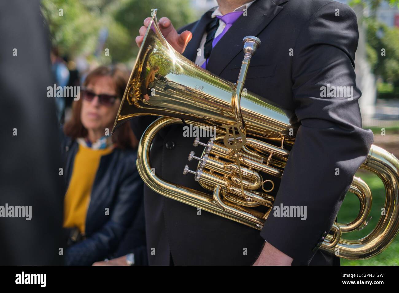 Madrid, Spain. 16th Apr, 2023. A musician carries a tuba during a ...