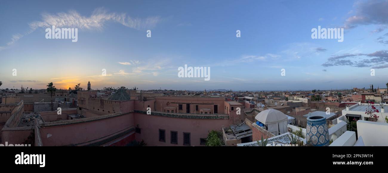 Morocco:sunset from a high rooftop, skyline of Marrakech, one of the ...