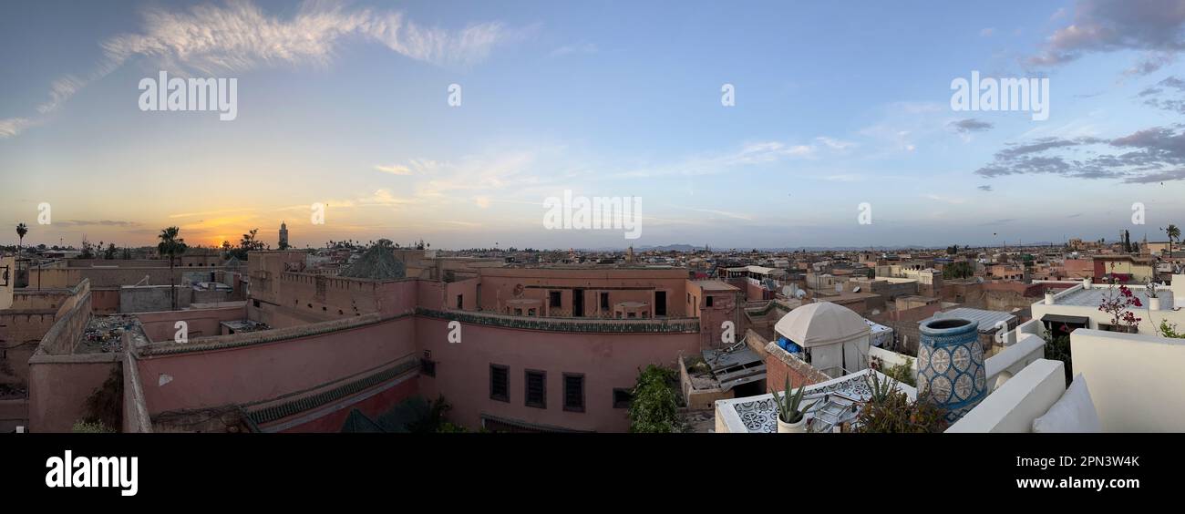 Morocco:sunset from a high rooftop, skyline of Marrakech, one of the ...