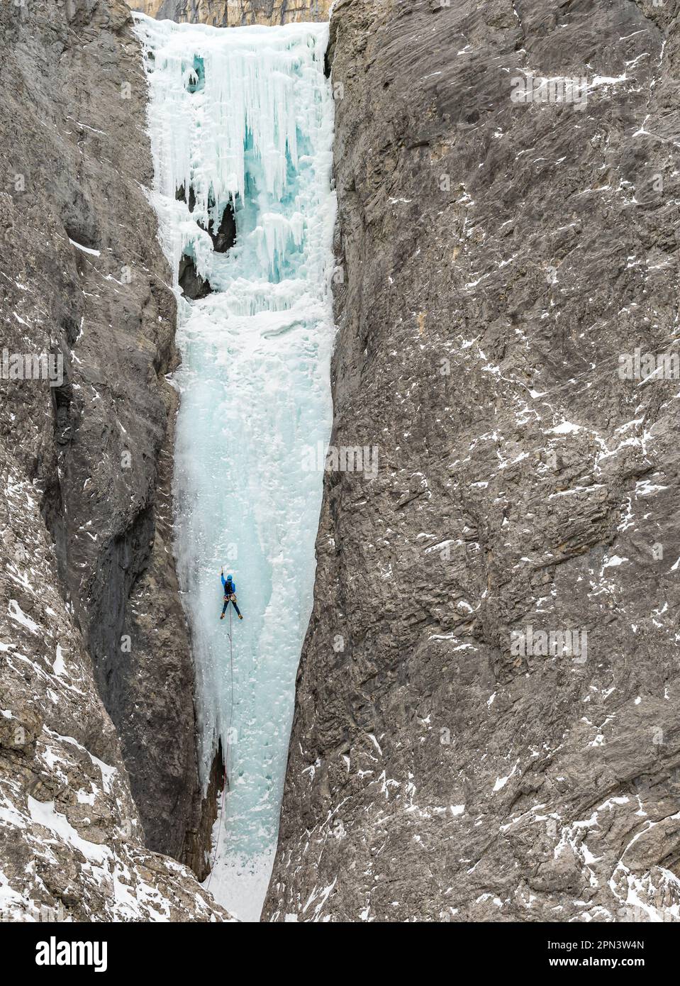 Rowan Lovell climbing a route called Wicked Wanda WI4+ in Canada Stock ...