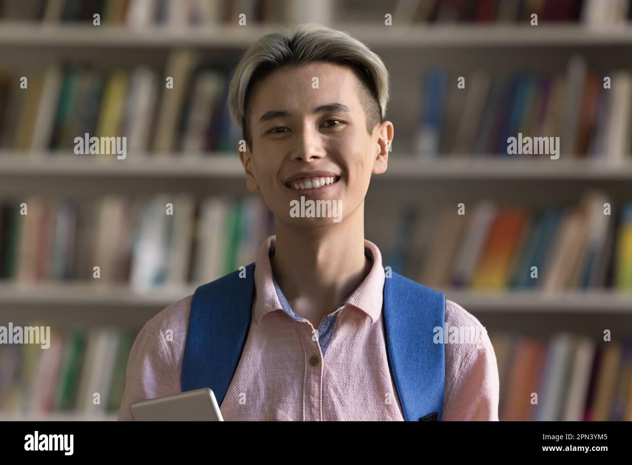 Asian student guy posing in library smile look at camera Stock Photo ...