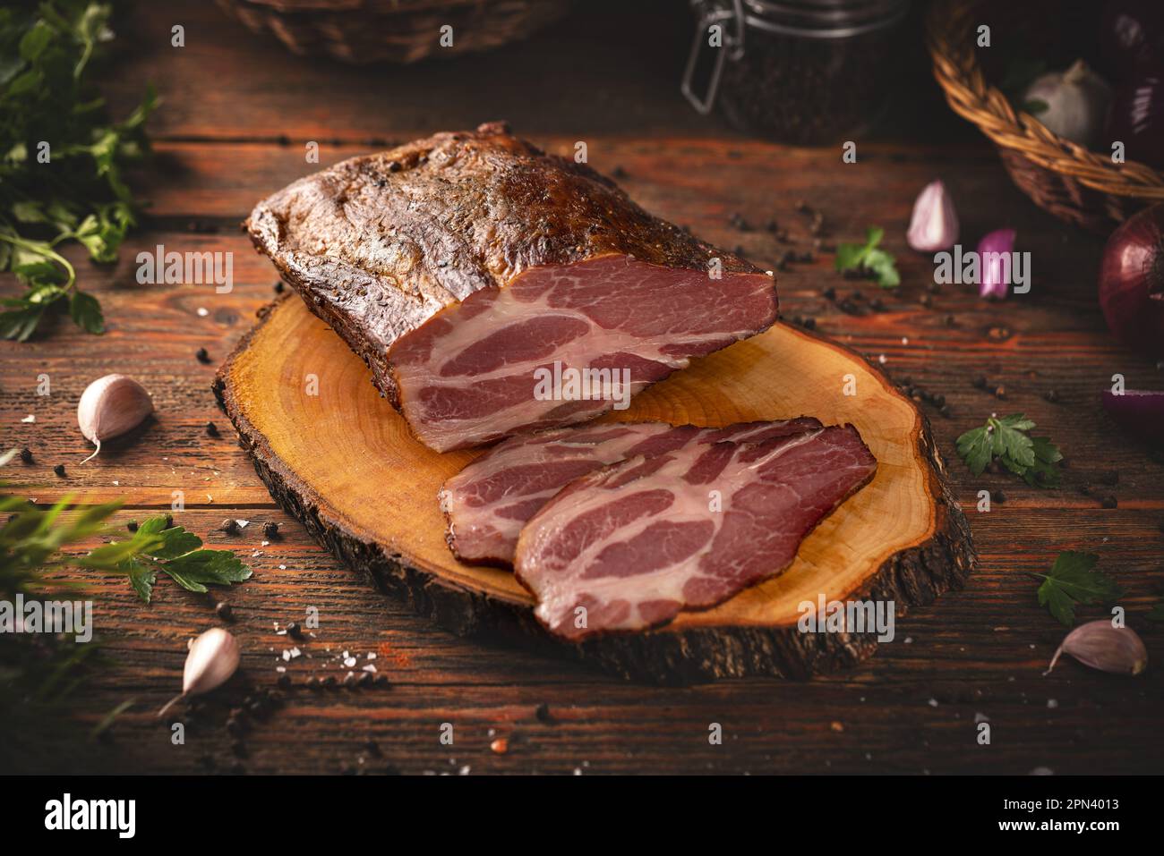 Air-cured pork meat coppa slice on rustic style wooden background Stock ...