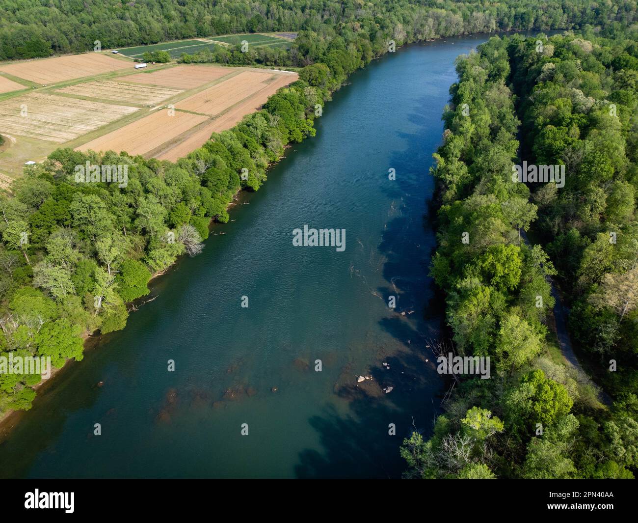 Agricultural fields ready to be planted next to calm Catawba River ...