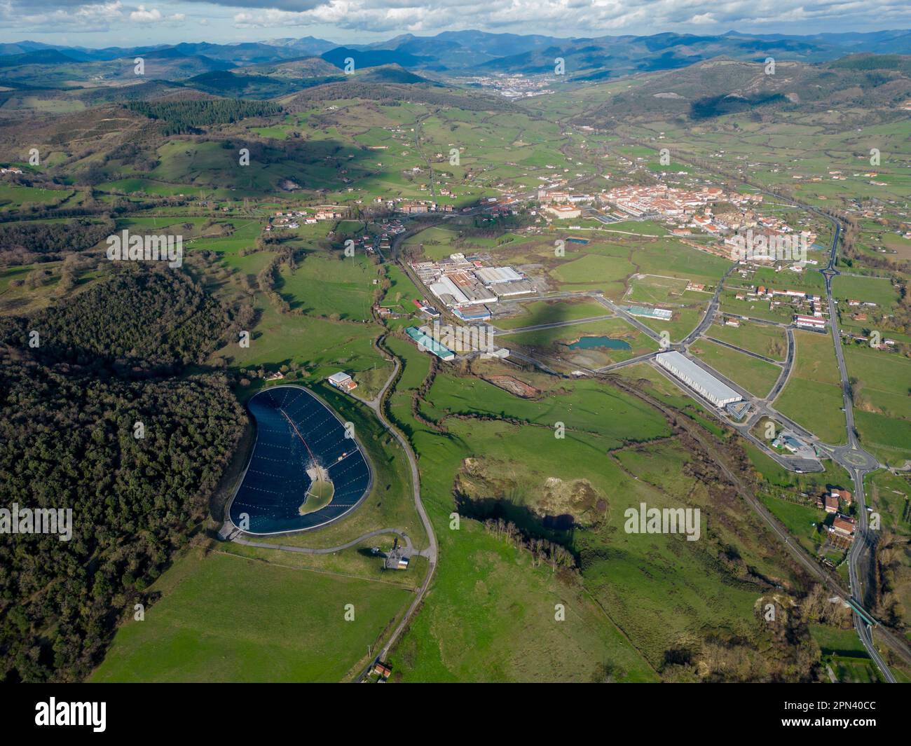 An aerial view of a mountainous landscape with green valleys in Basque ...