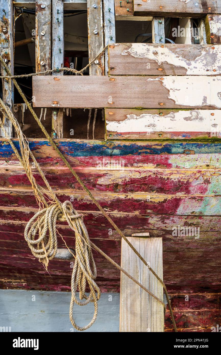 Old weathered and faded wooden planks on the keel of a boat being ...