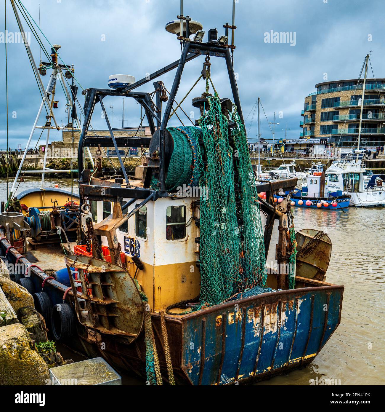 Fishing trawler with nets. UK fishing industry. Concept. Food ...