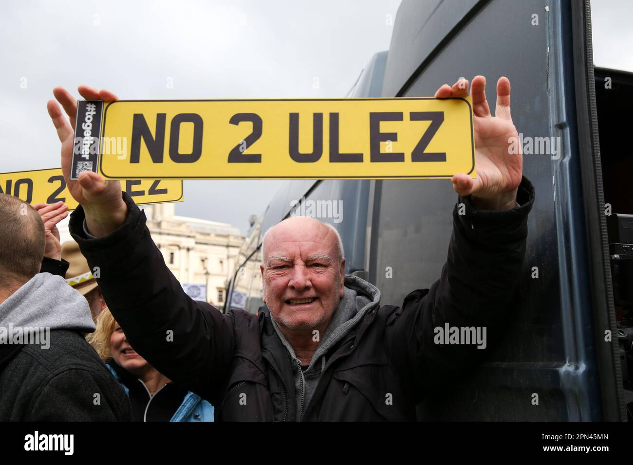 London, UK. 15th Apr, 2023. A protester holds a 'No 2 ULEZ' sign during ...