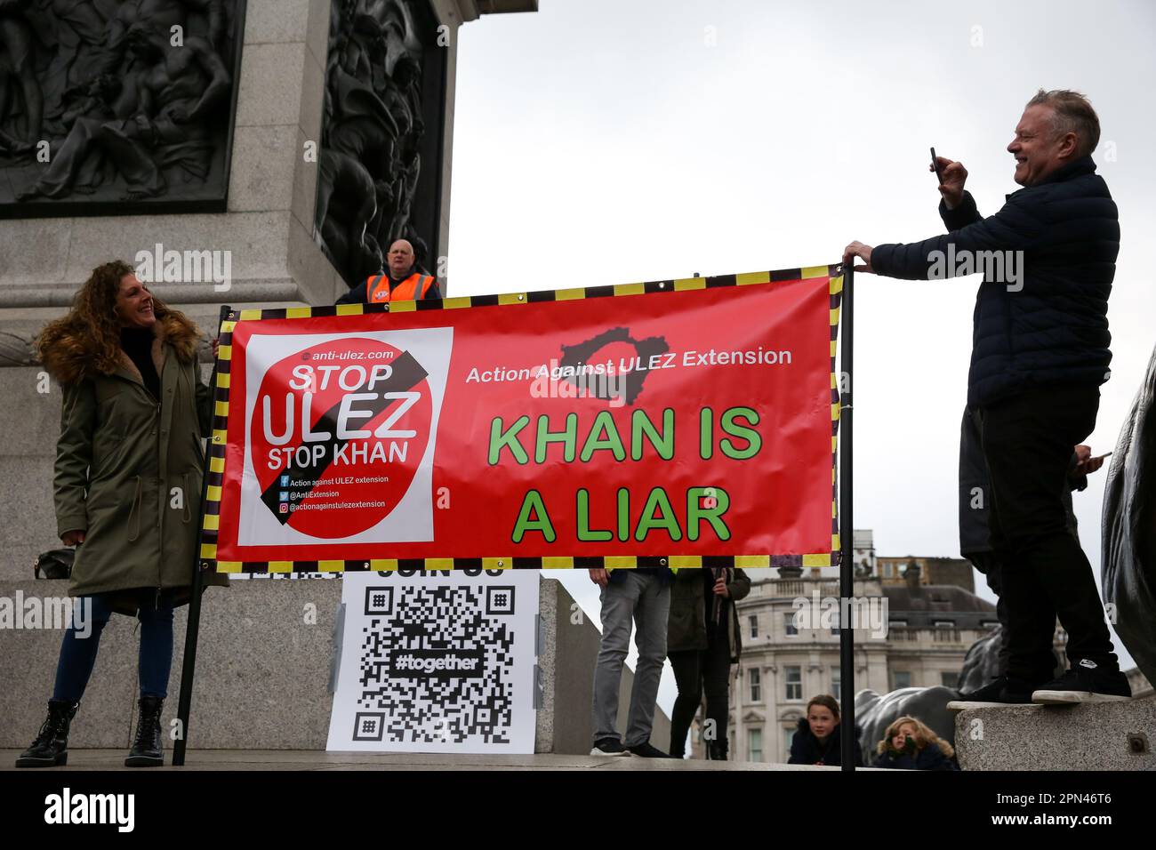 London, UK. 15th Apr, 2023. Protesters hold a banner expressing their ...