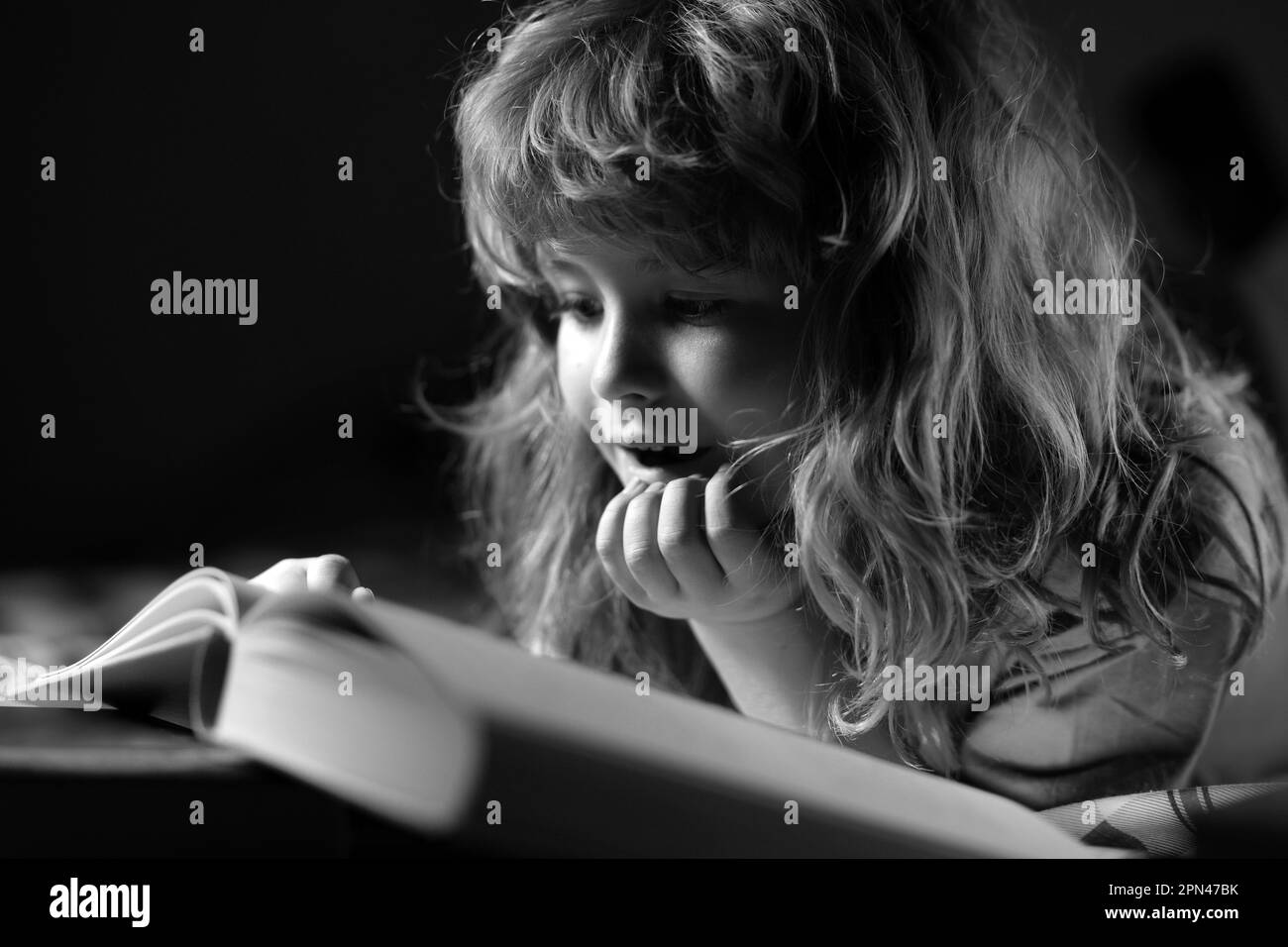 Child reading book. Kids read books. Little boy sitting on in living ...