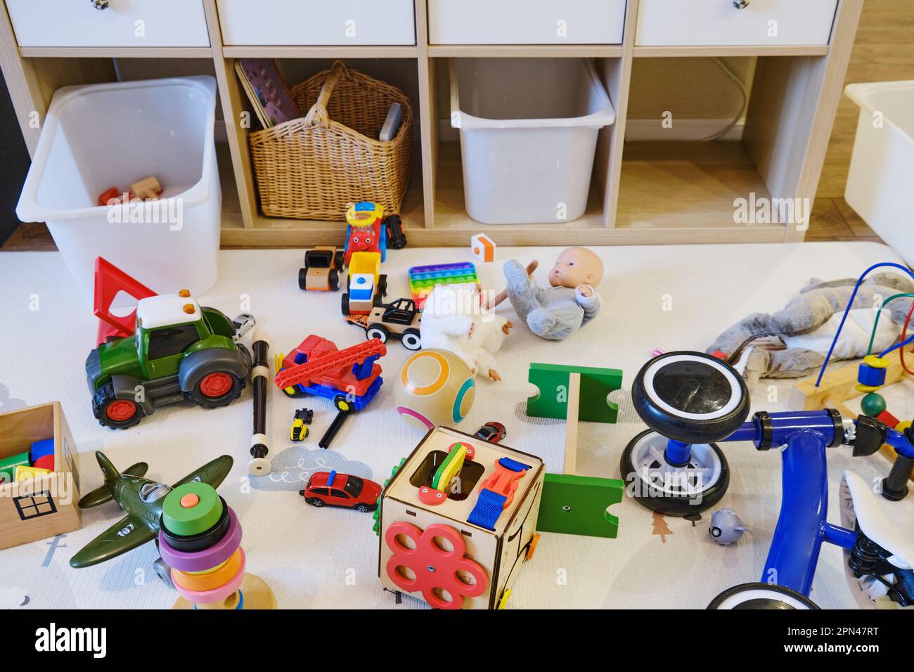 Children's room littered with toys before cleaning. Mess with toys ...