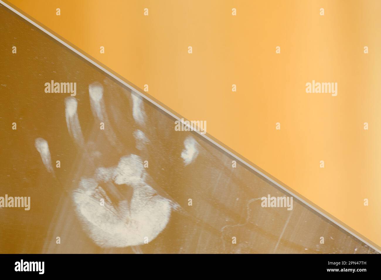 A child's palm print and dirt on the window glass, before and after ...