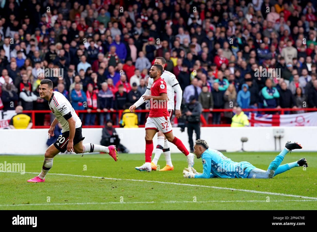 Manchester United's Diogo Dalot (left) celebrates scoring their side's ...