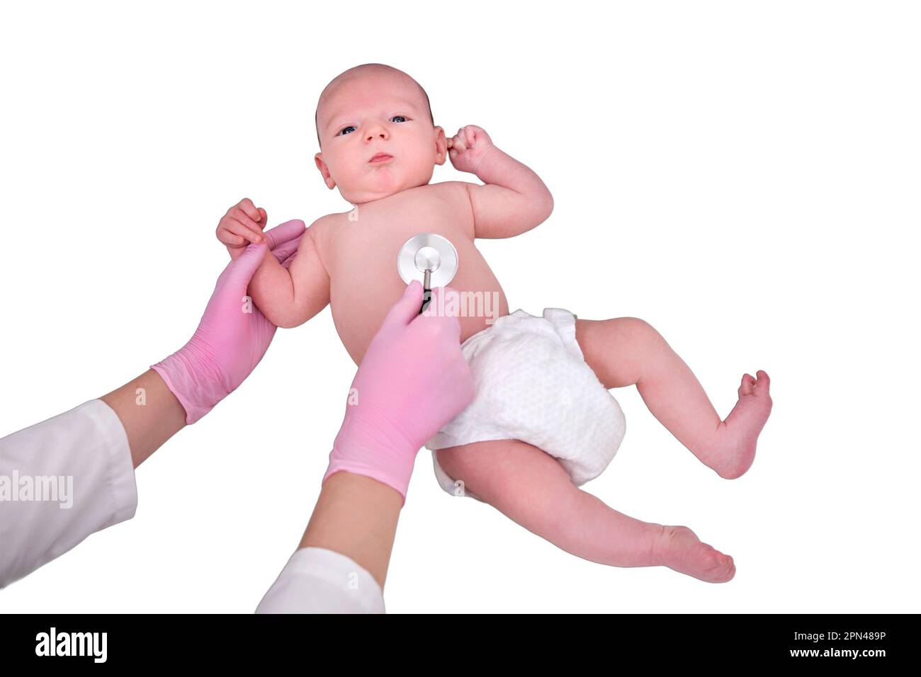 Woman doctor listens with a stethoscope to a newborn baby, isolated on ...