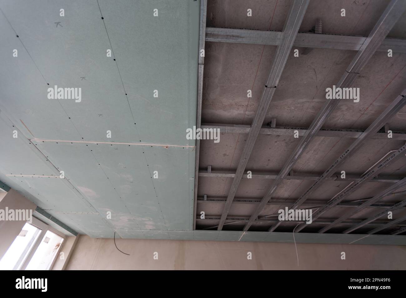 Working process of installing metal frames for plasterboard -drywall ...