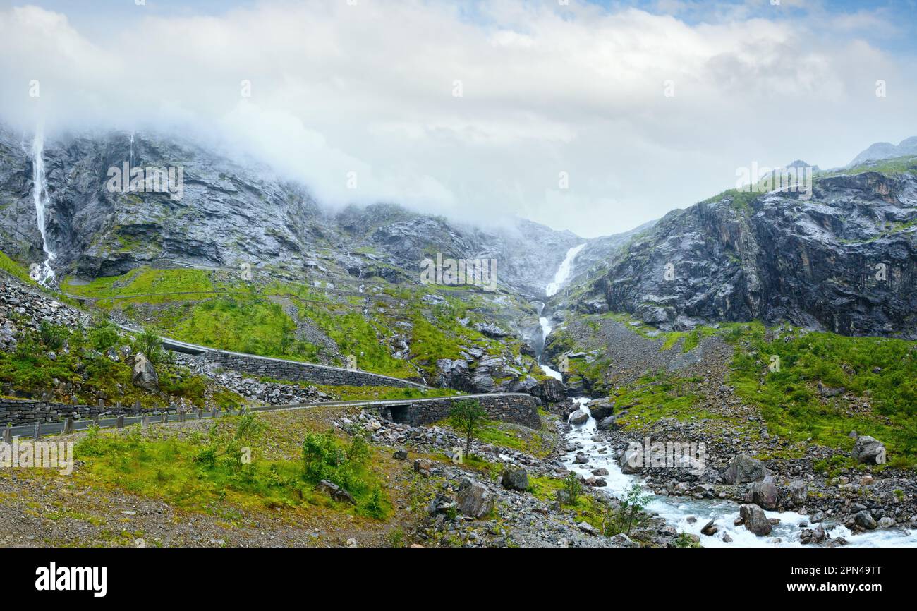 Summer mountain cloudy view with waterfall on Trollstigen (The troll ...