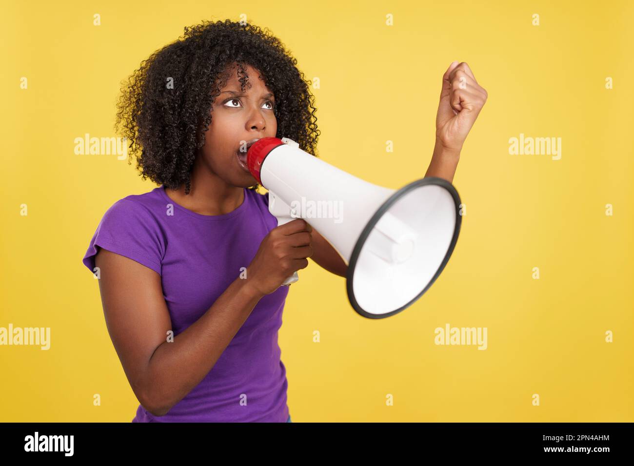 African woman yelling while using a mefaphone Stock Photo - Alamy