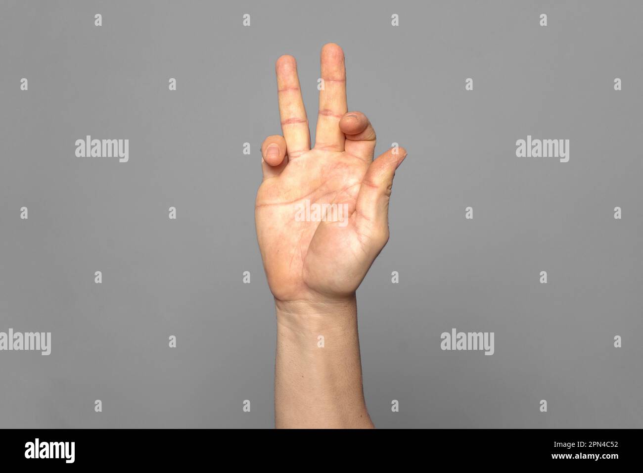 Hands showing sign language alphabet hi-res stock photography and ...
