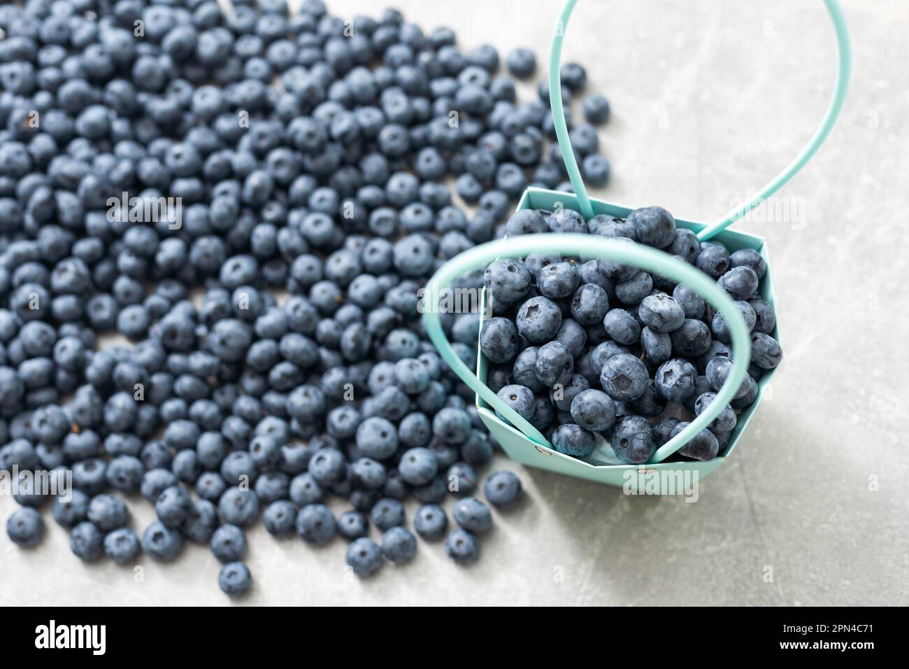 large blueberry with paper basket Stock Photo - Alamy