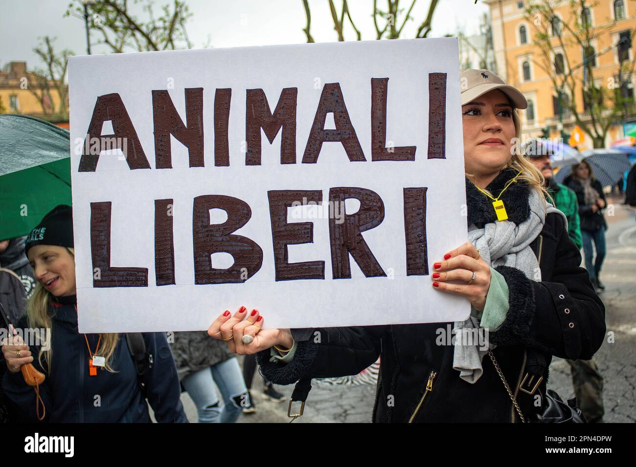 An animal rights activist holds a placard during the demonstration ...