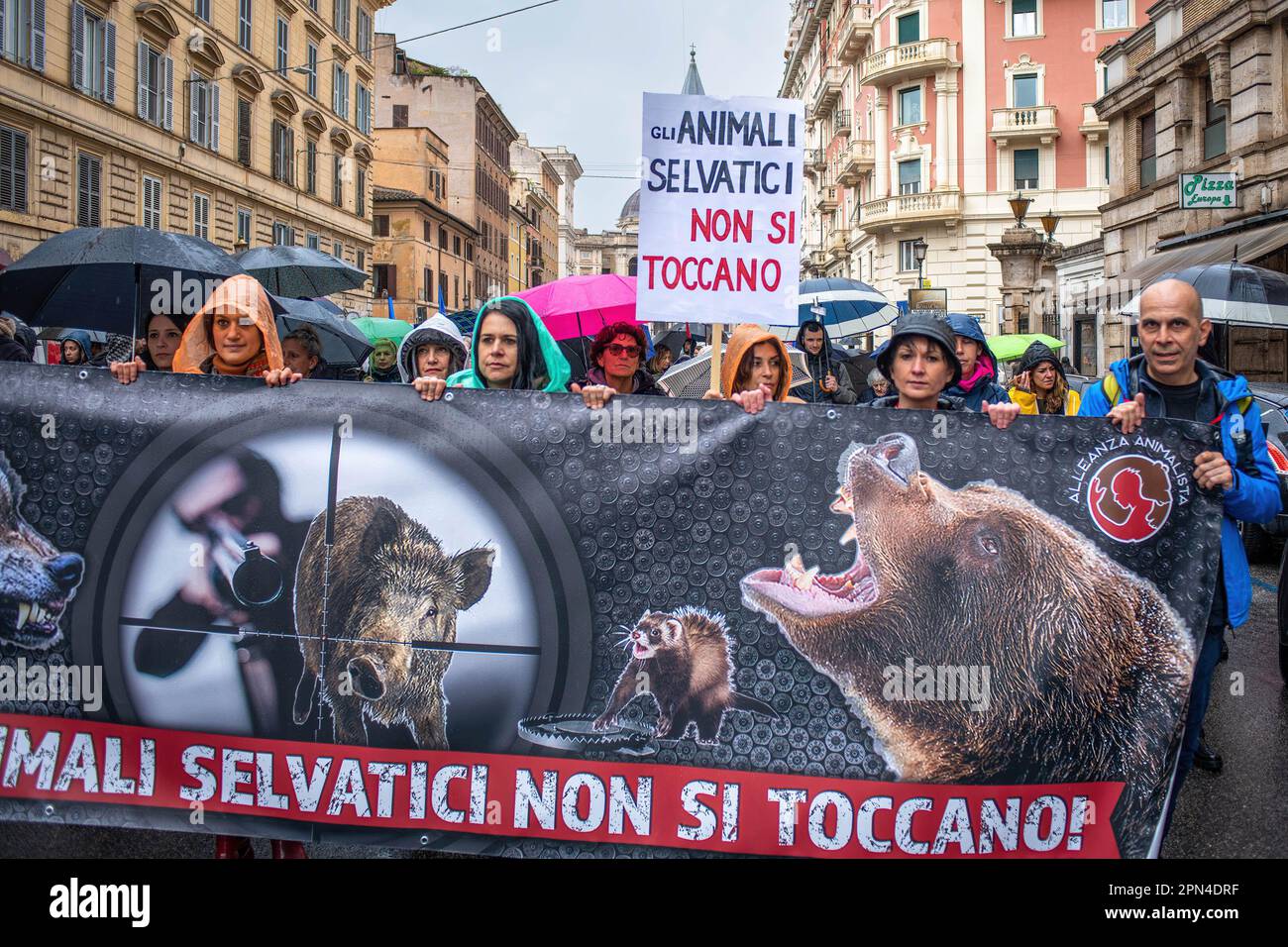 Animal rights activists hold a banner during the demonstration ...