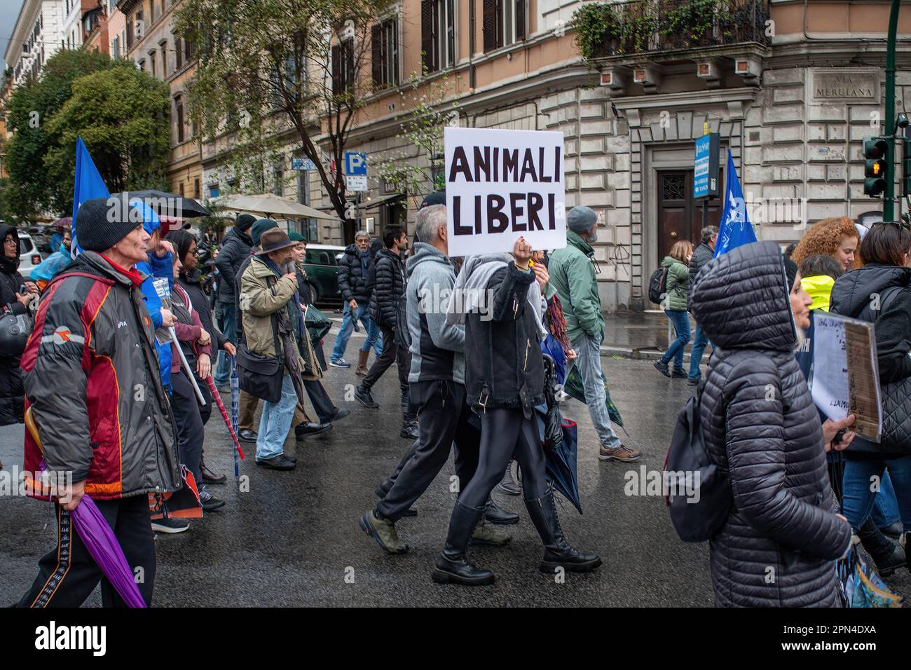 An animal rights activist holds a placard during the demonstration ...