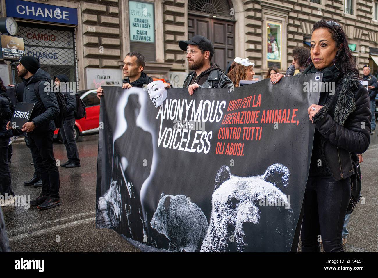 Animal rights activists hold a banner during the demonstration ...