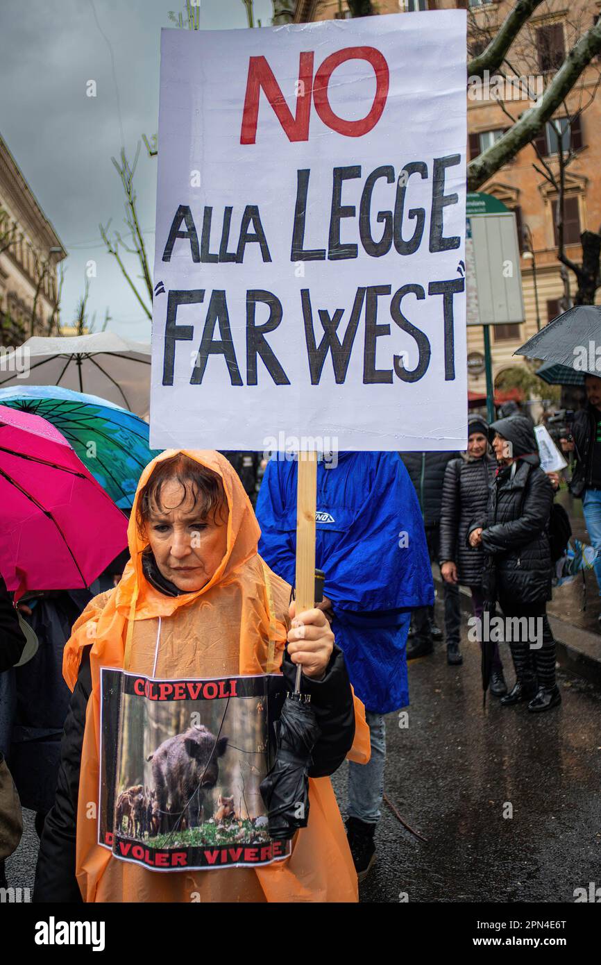 An animal rights activist holds a placard during the demonstration ...