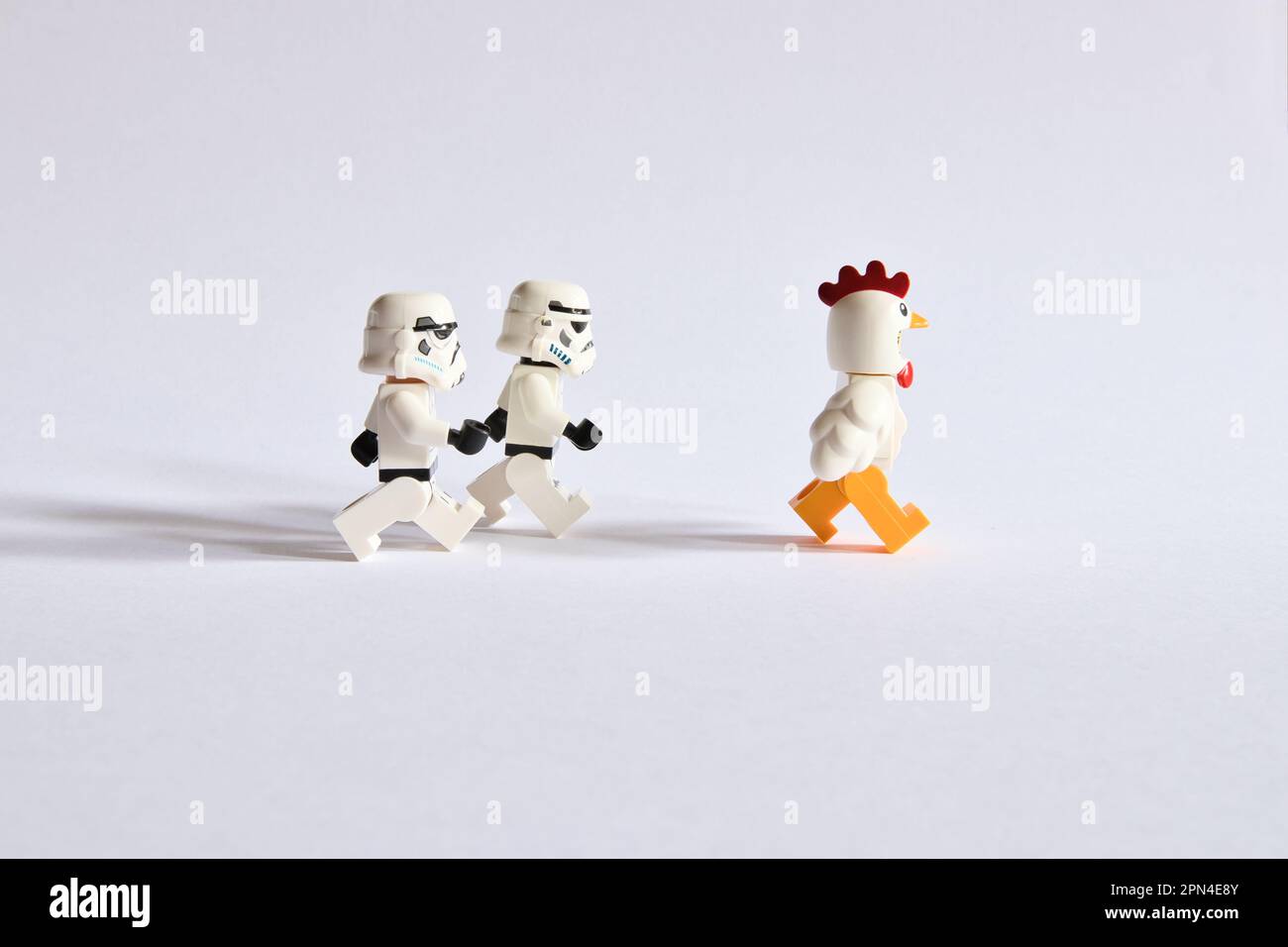 Stormtrooper chasing chicken Stock Photo - Alamy