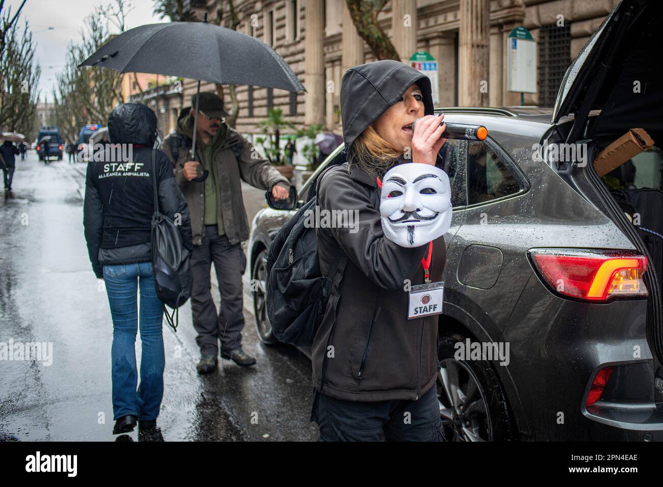 Animal rights activist speaks on a microphone during the demonstration ...