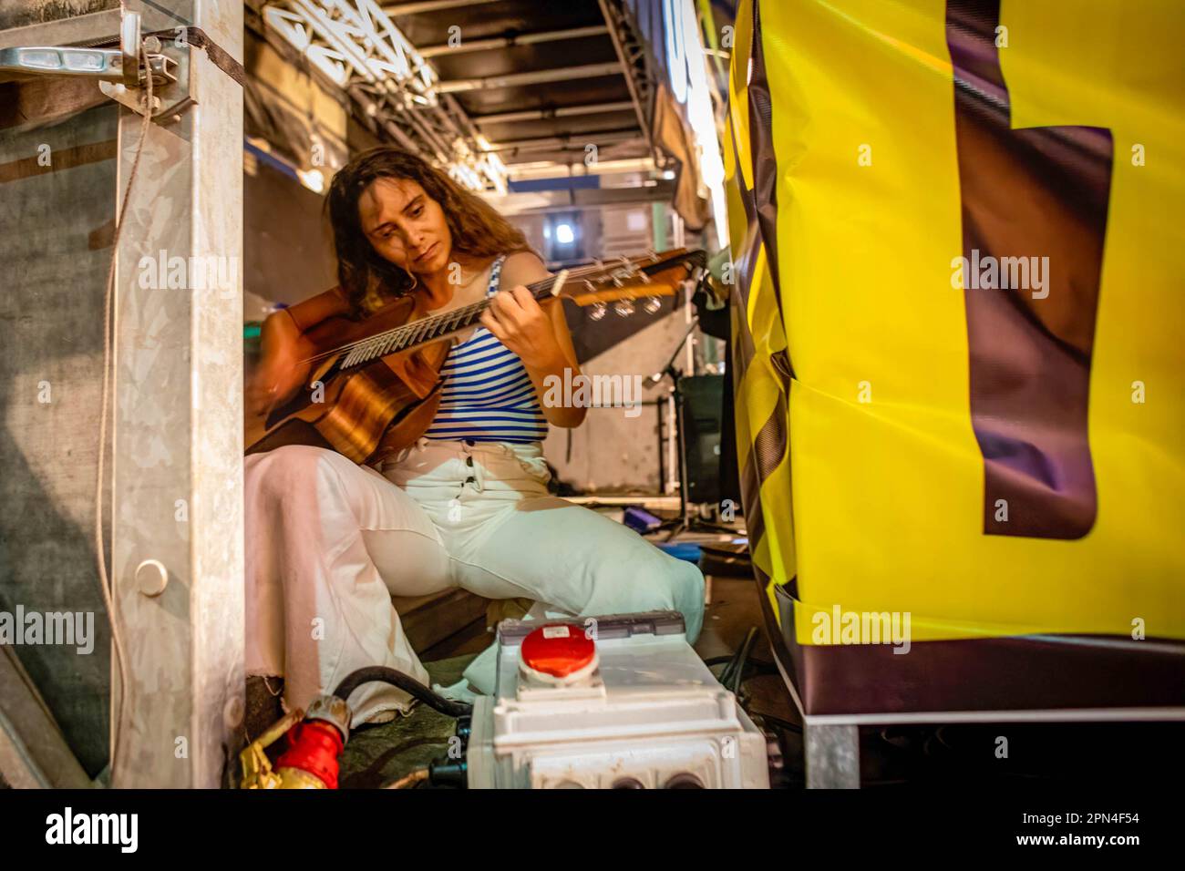 Netanya, Israel. 15th Apr, 2023. An artist plays her guitar prior to ...