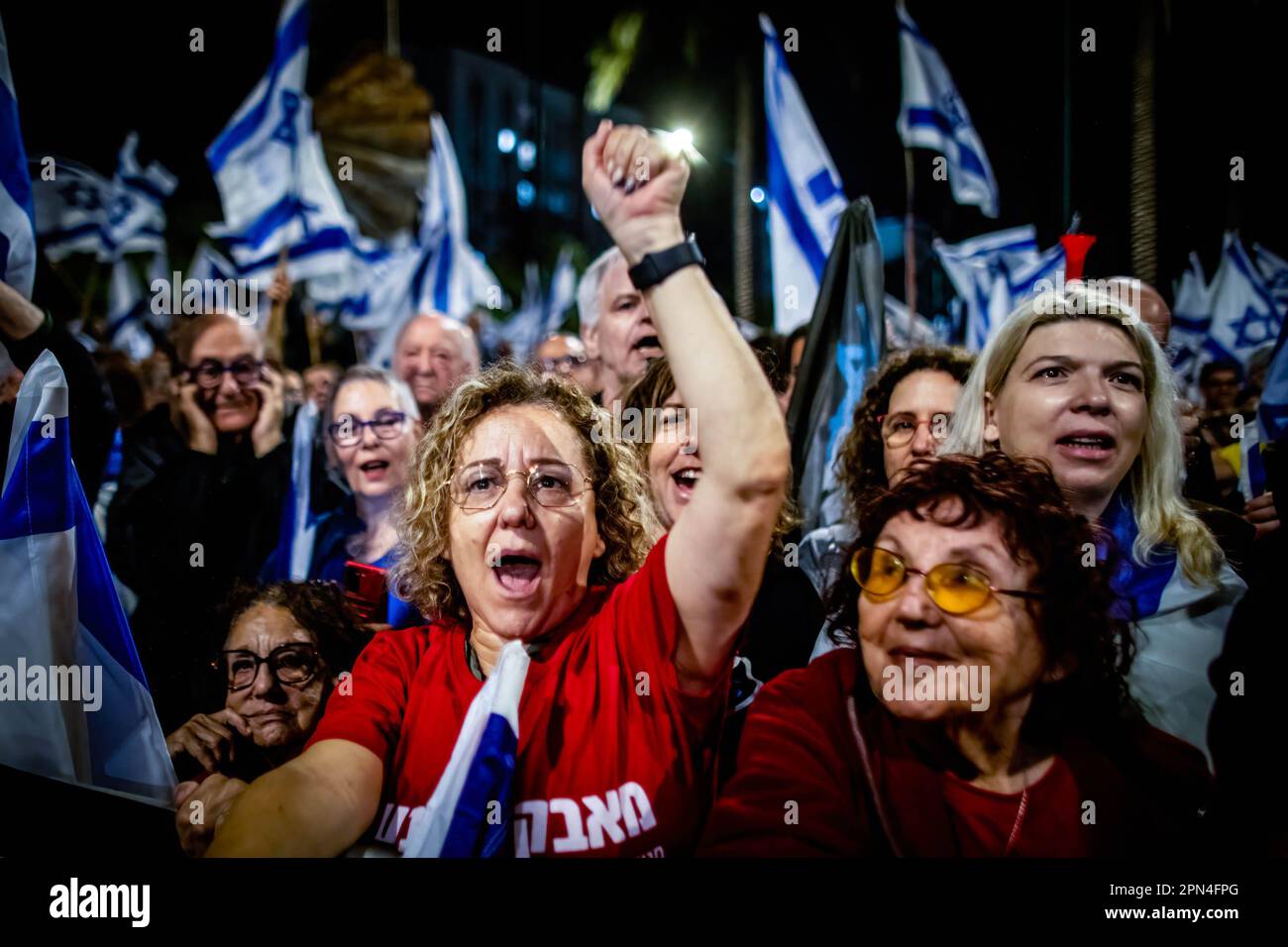 Netanya, Israel. 15th Apr, 2023. An Israeli protestor waves her fist ...