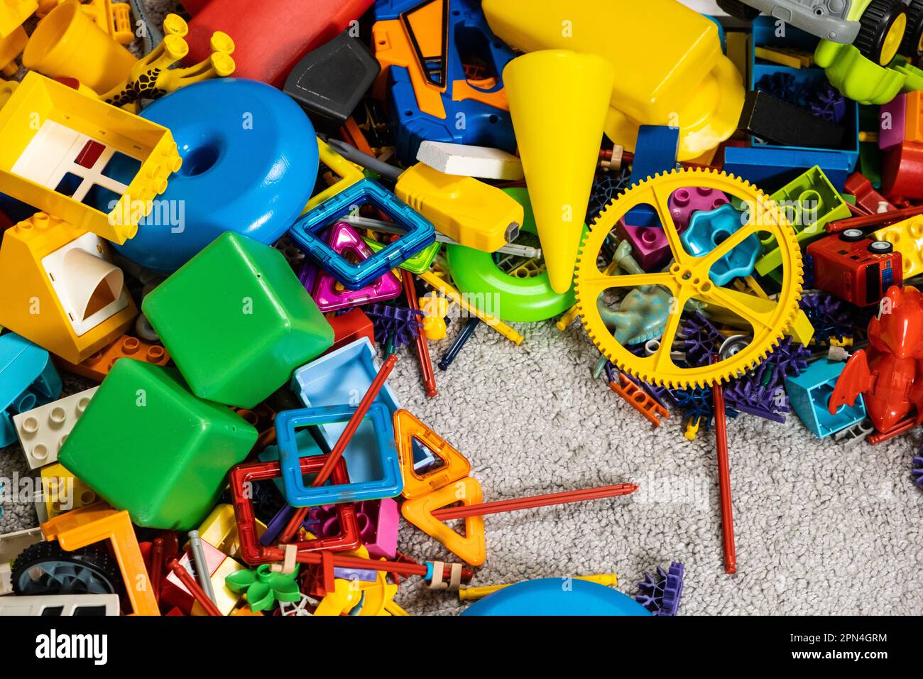 An abundance of toys in the children's room, a lot of plastic multi ...