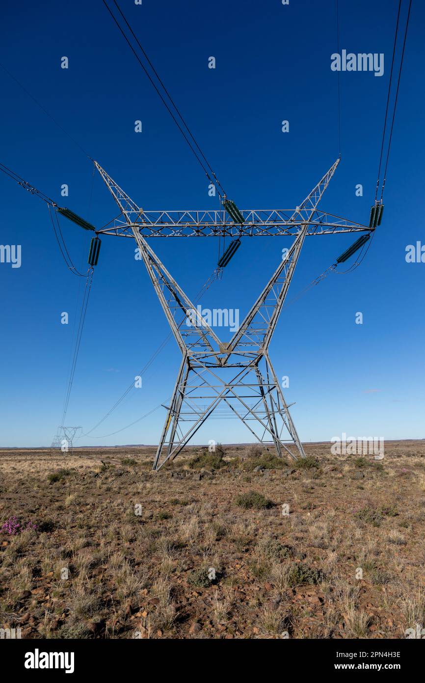 Electricity transmission pylons with other pylons and lines running ...