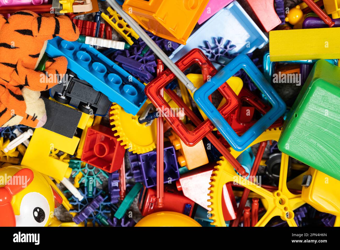 An abundance of toys in the children's room, a lot of plastic multi ...