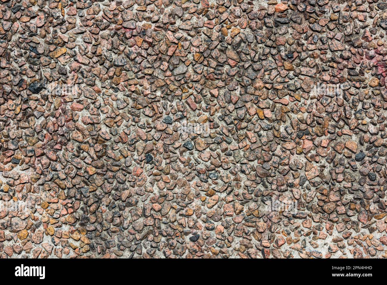 Gravel embedded in a concrete plate used as a wall element Stock Photo ...
