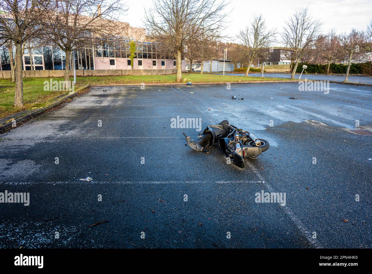 Broken and abandoned moped on a parking lot Stock Photo - Alamy