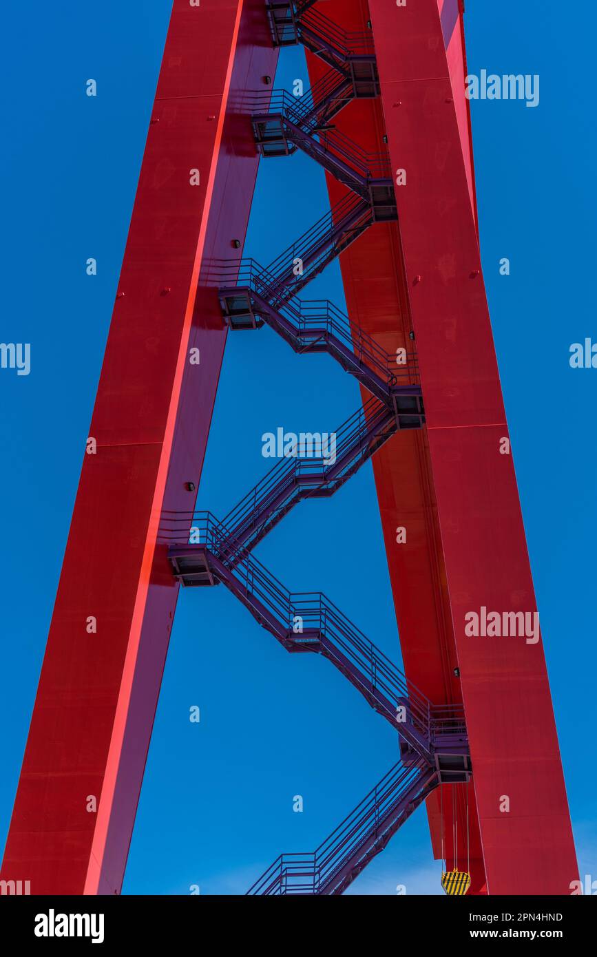 Stairs up the side of a giant red gantry crane Stock Photo - Alamy