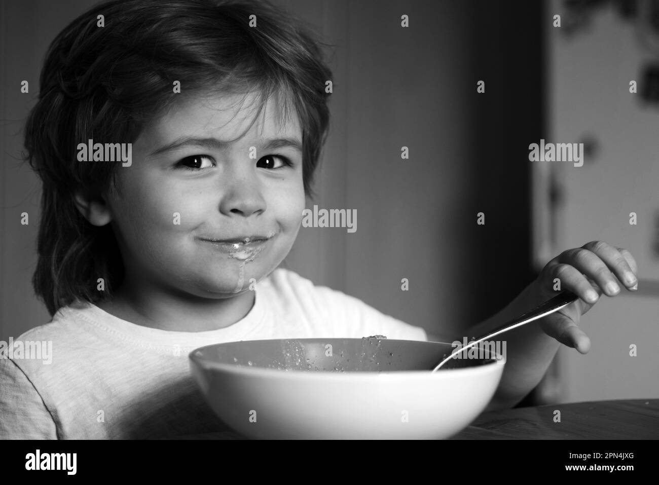 Funny Little baby are eating. Happy baby boy eats healthy food spoon ...