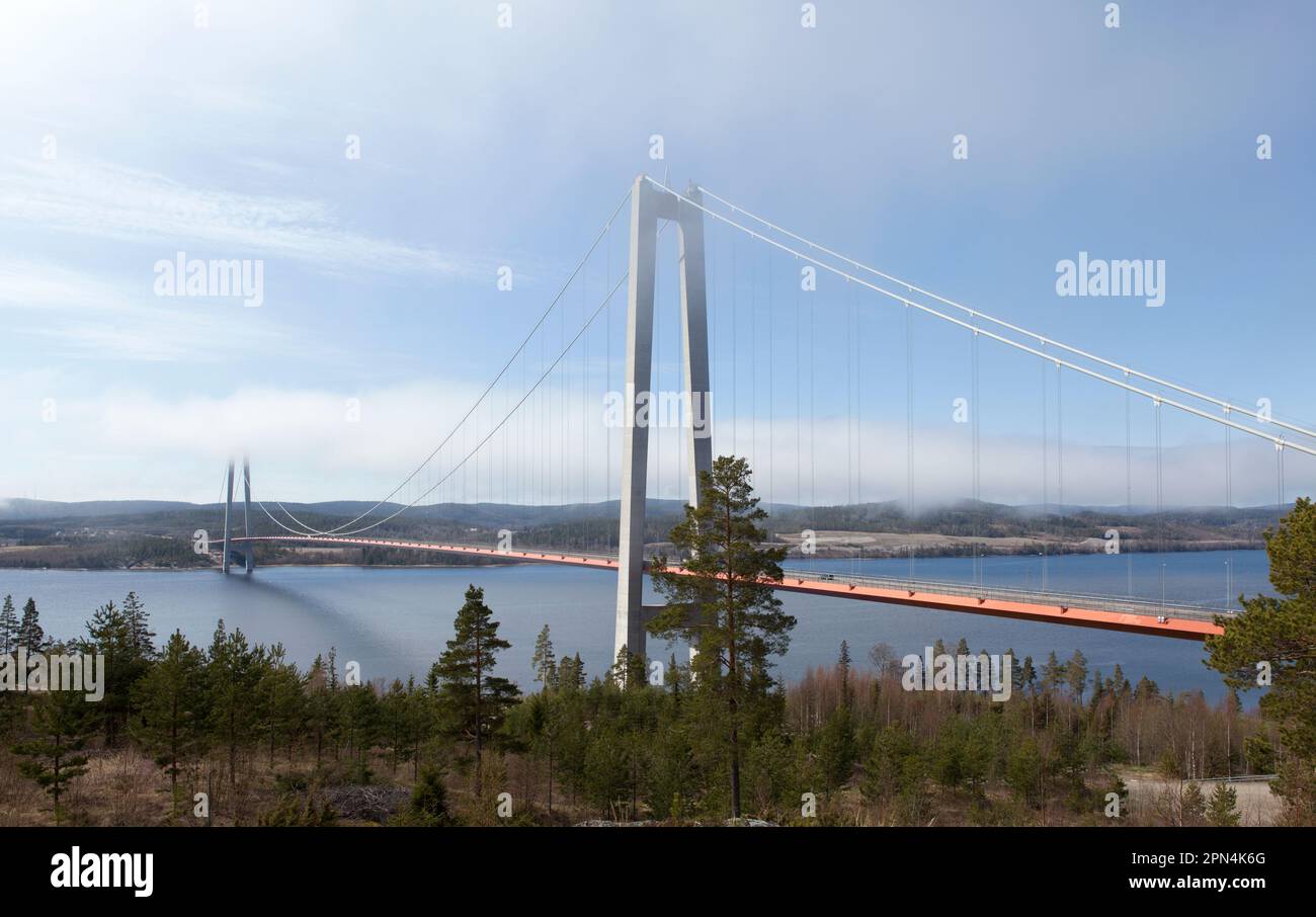 High Coast Bridge, Sweden in daylight. River, forests and some clouds ...