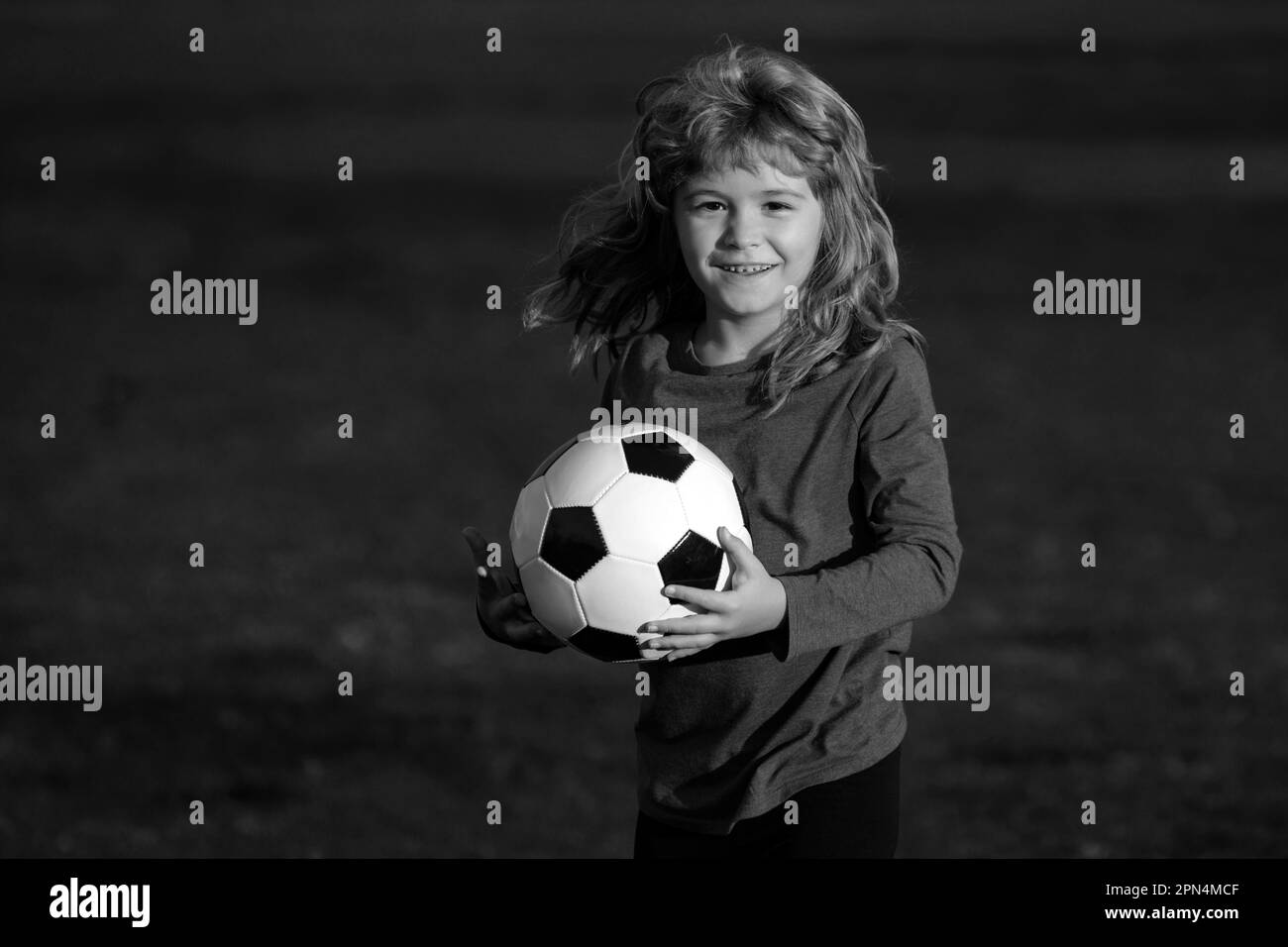 Soccer kid. Kid holding soccer ball, closeup kids portrait. Football ...