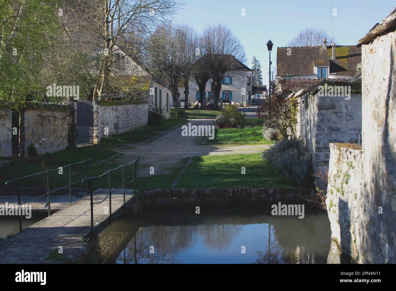 Flagy: a pedestrian bridge across the Orvanne on the rue Monte à Regret ...