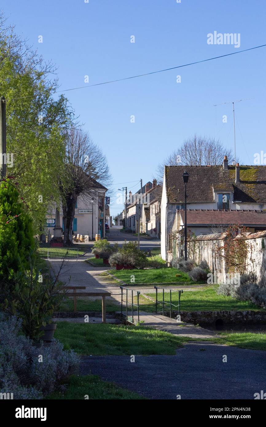 Flagy, France: a pedestrian bridge across the Orvanne on the rue Monte ...