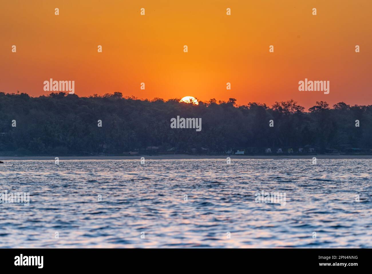Yellow sun coming out of the sea hi-res stock photography and images ...