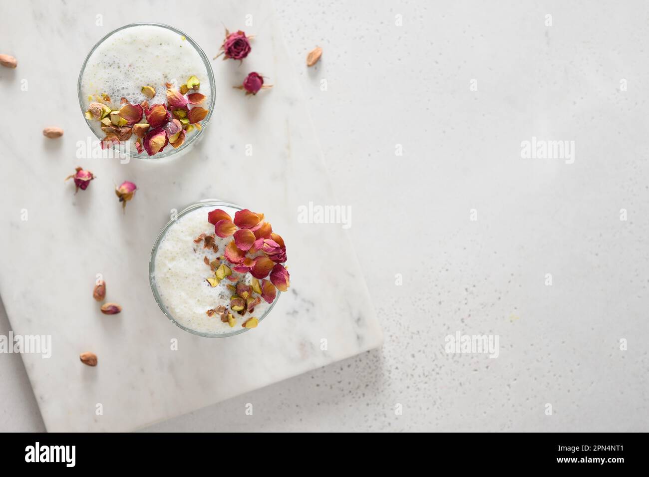 Indian Sweet lassi with saffron and rose water on white background ...