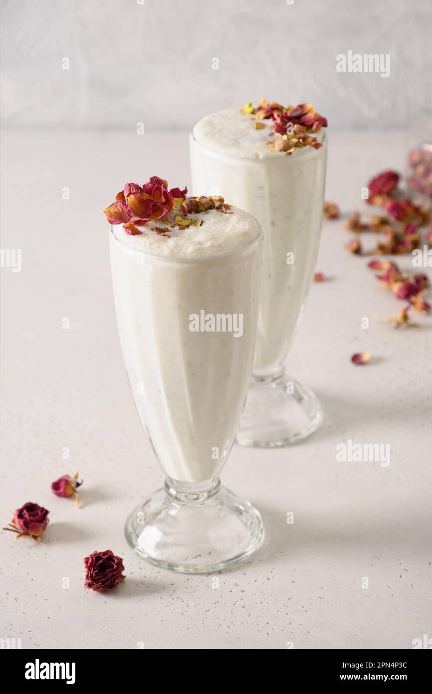 Indian Sweet lassi with saffron and rose water on white background ...