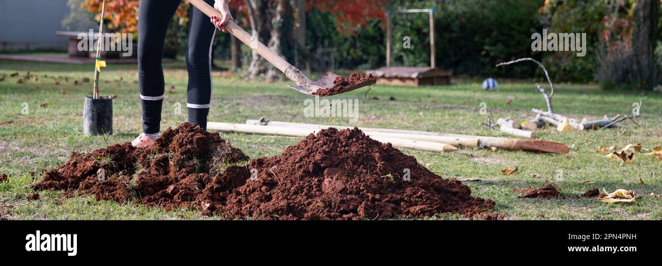 Woman digging in soil garden hi-res stock photography and images - Alamy