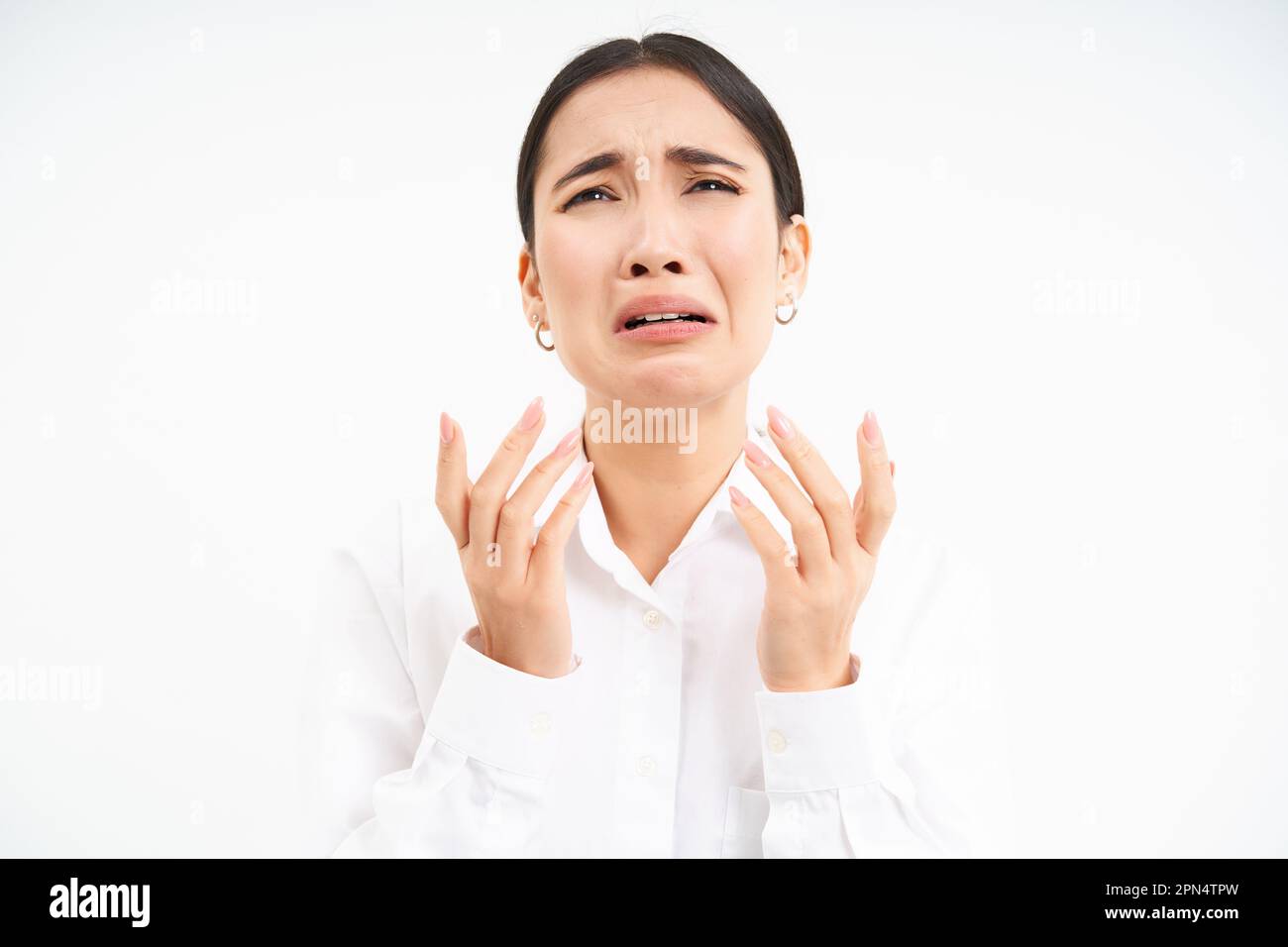 Upset asian woman looks up with desperate and sad face, complains to ...