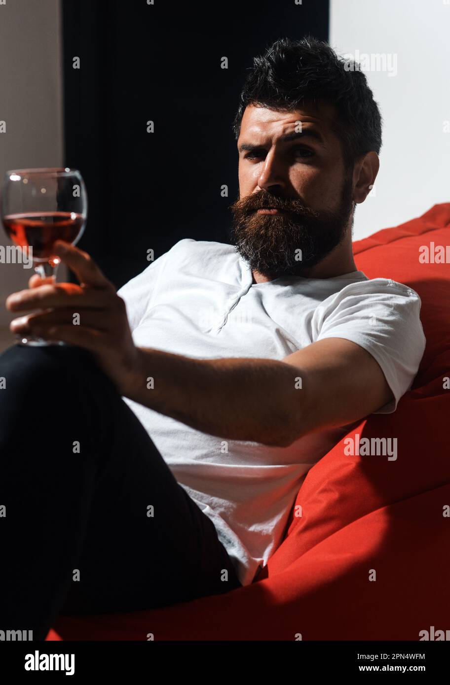 Man in depression drinking wine. Alcohol addiction. Home alone drunk ...